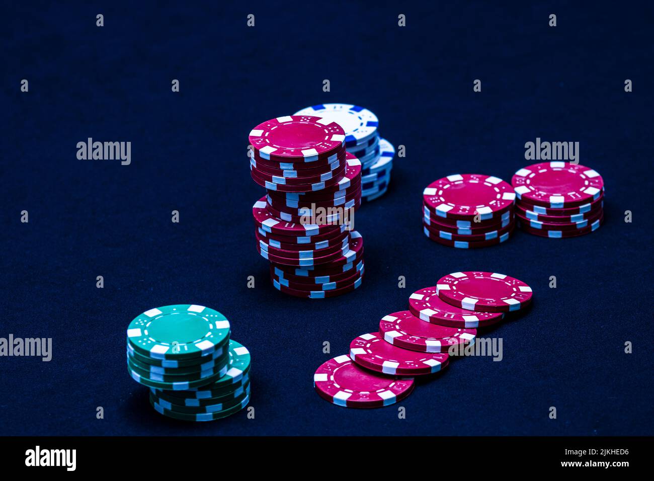 Stack of poker chips on black background Stock Photo - Alamy