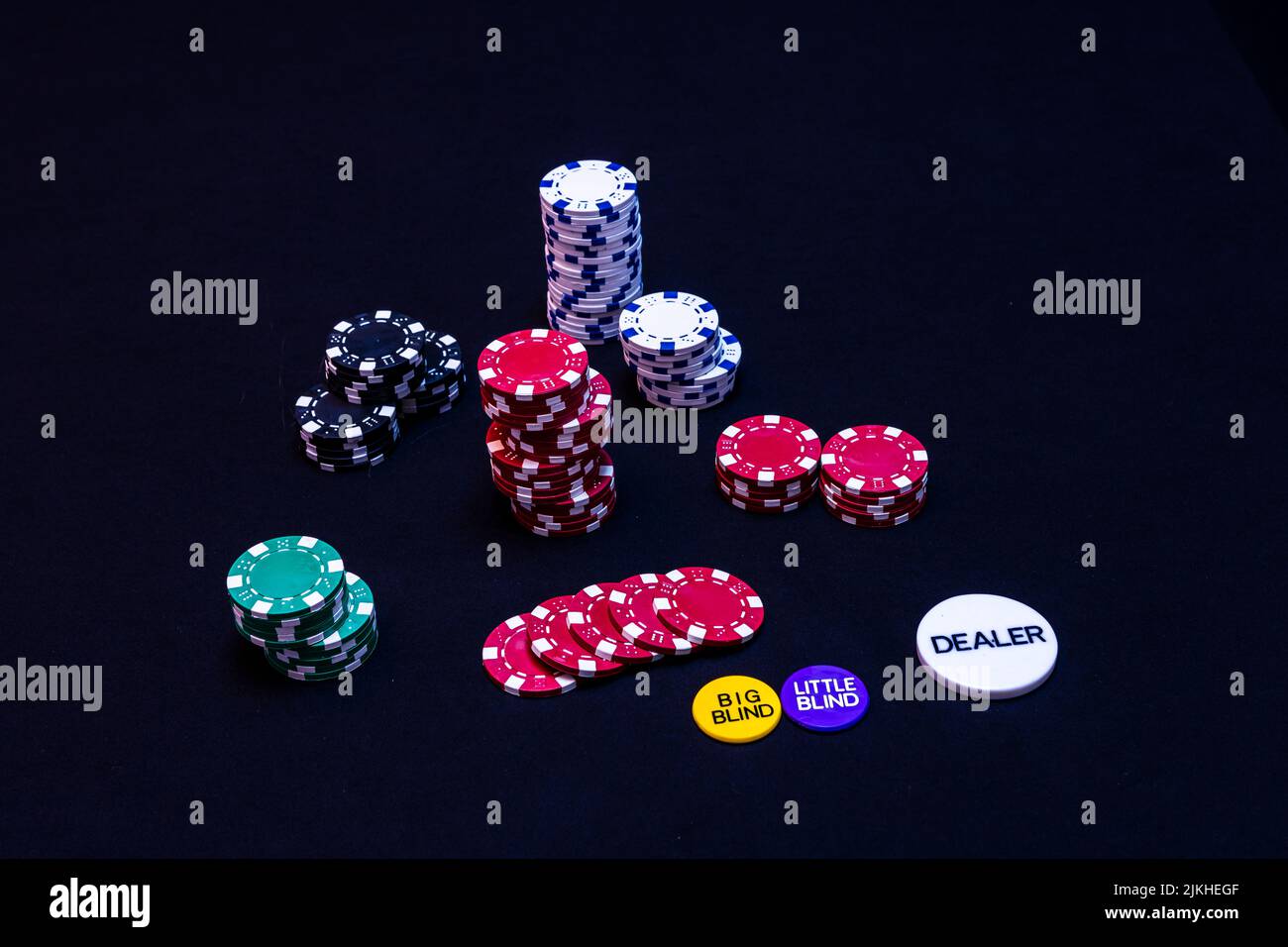 Stack of poker chips on black background Stock Photo - Alamy