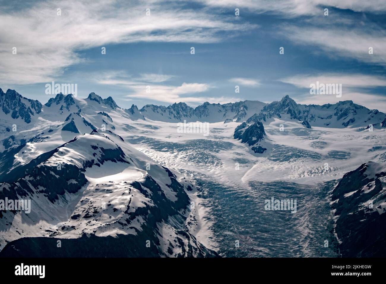 A mesmerizing view of the blue sky over snowy frozen landscapes of New ...