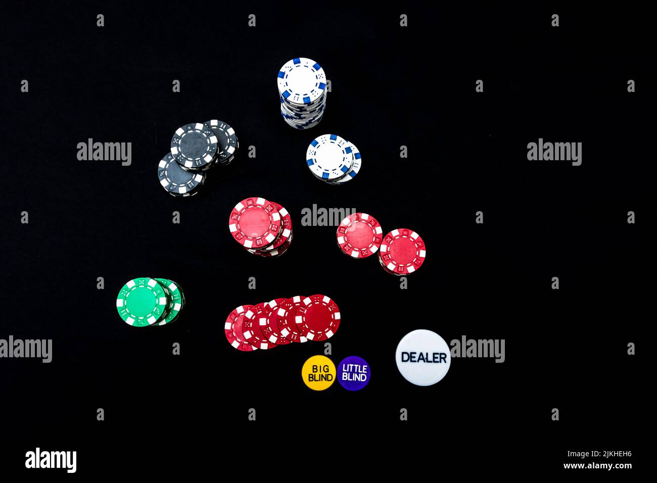 Stack of poker chips on black background Stock Photo - Alamy
