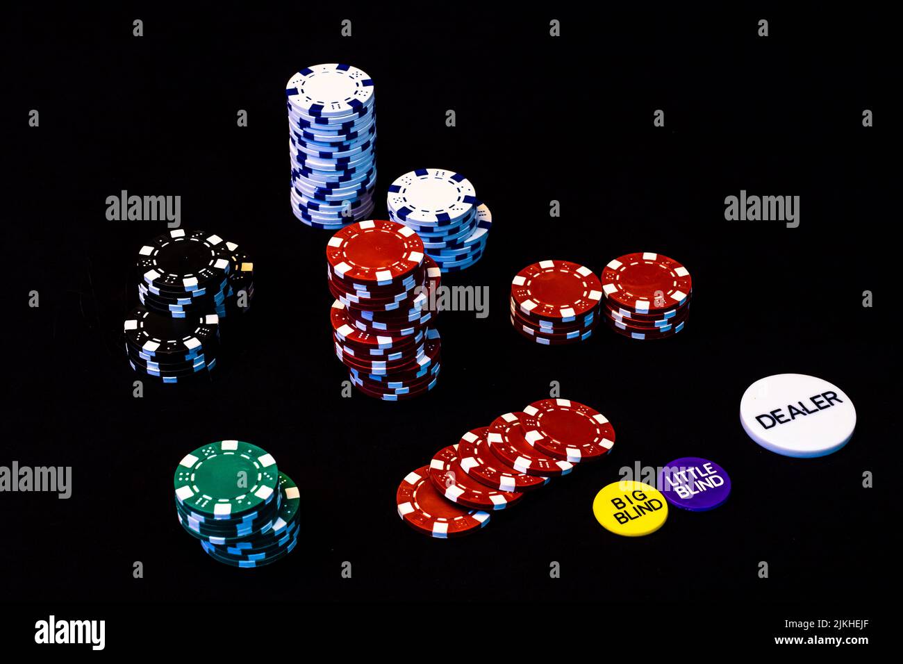 Stack of poker chips on black background Stock Photo - Alamy