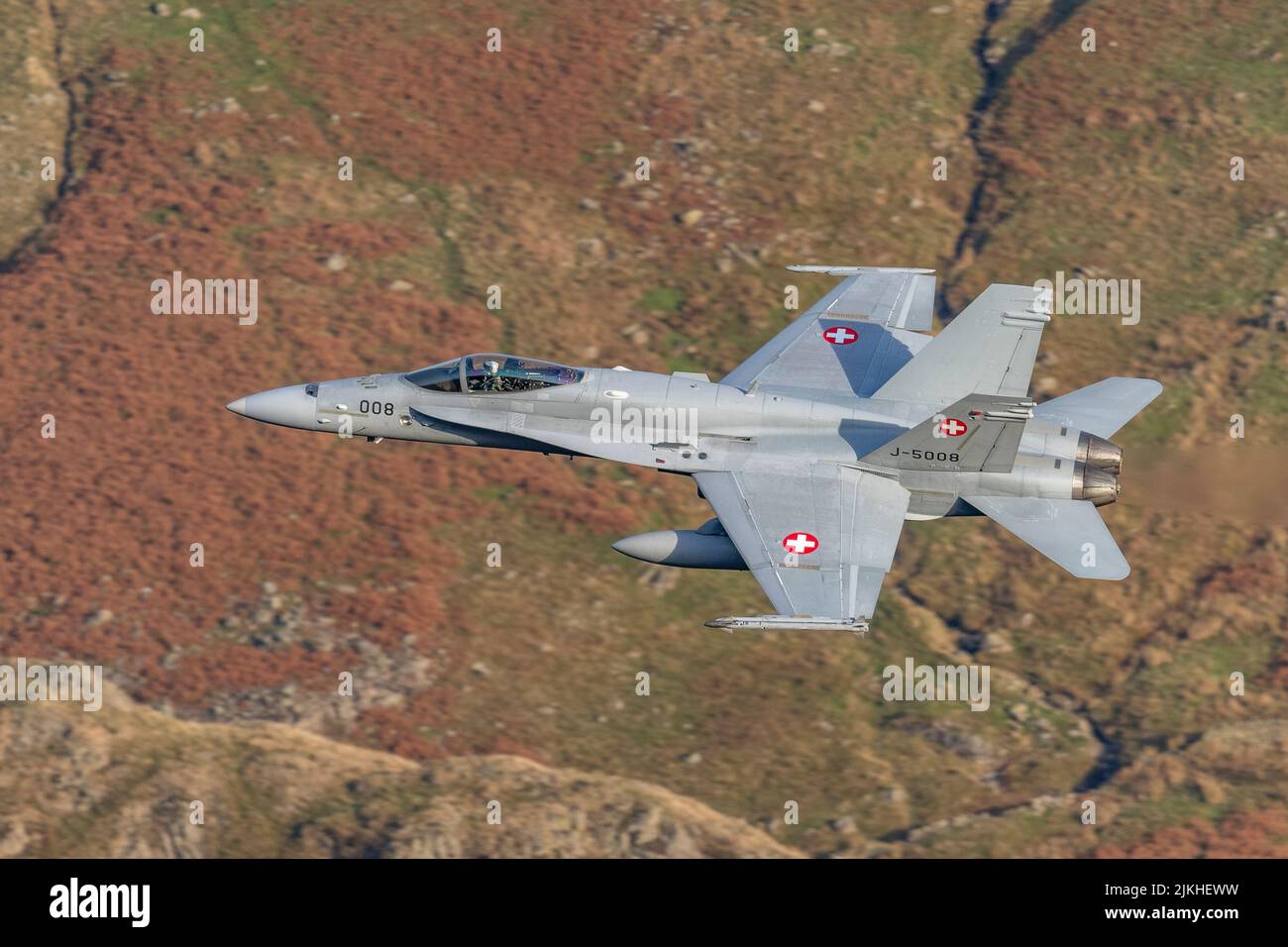 An aerial shot of a Swiss Air Force F18 Hornet low-level training over ...