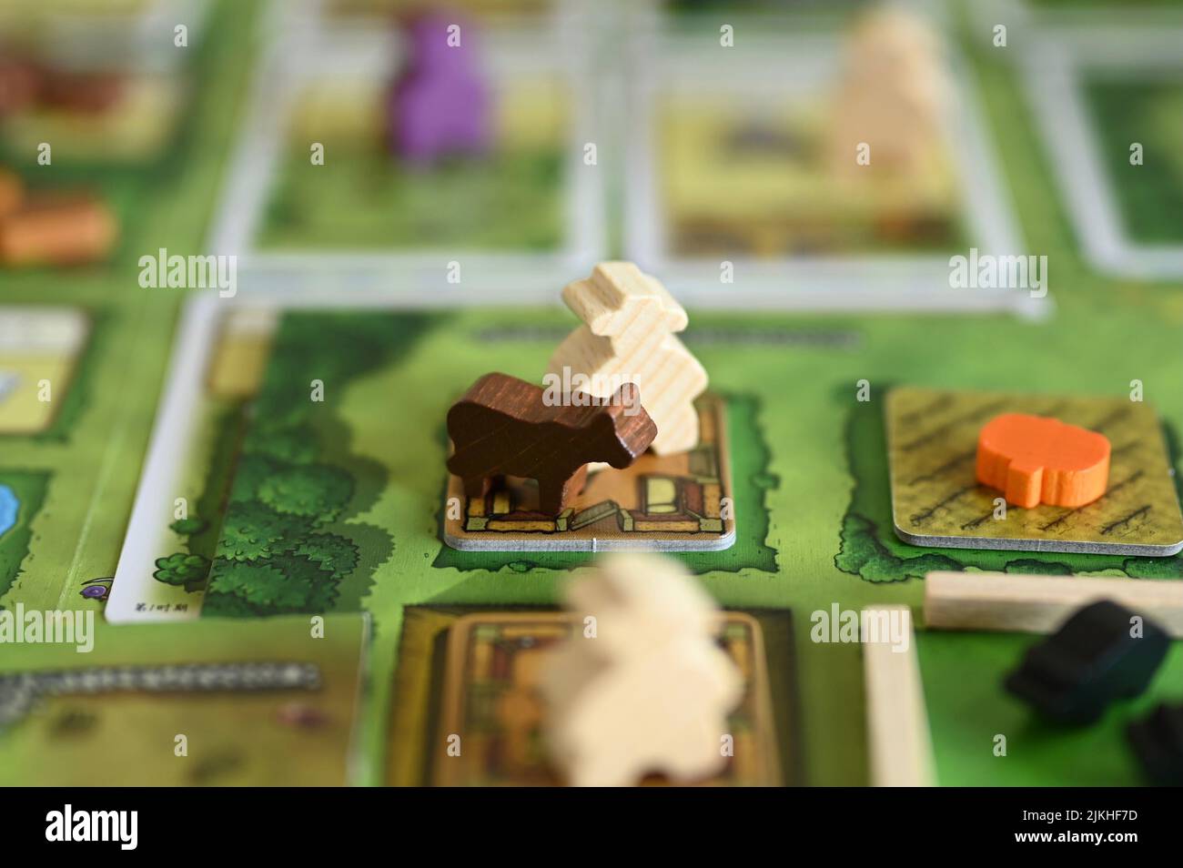 A closeup of the Board Game Agricola, with figures Stock Photo - Alamy