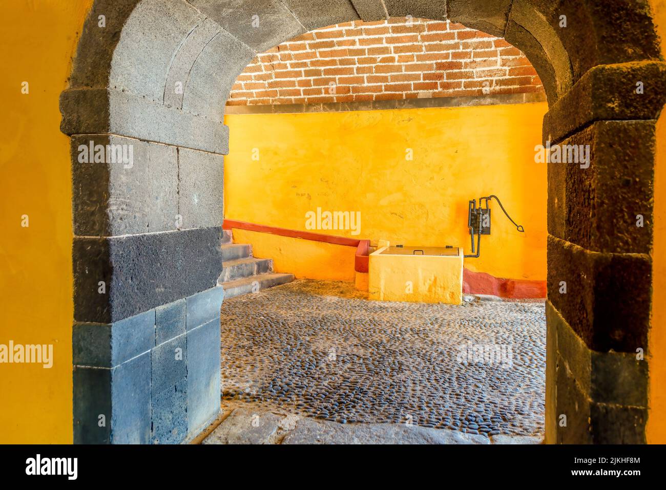 An old interior design and stairs from arch window in the Yellow castle ...