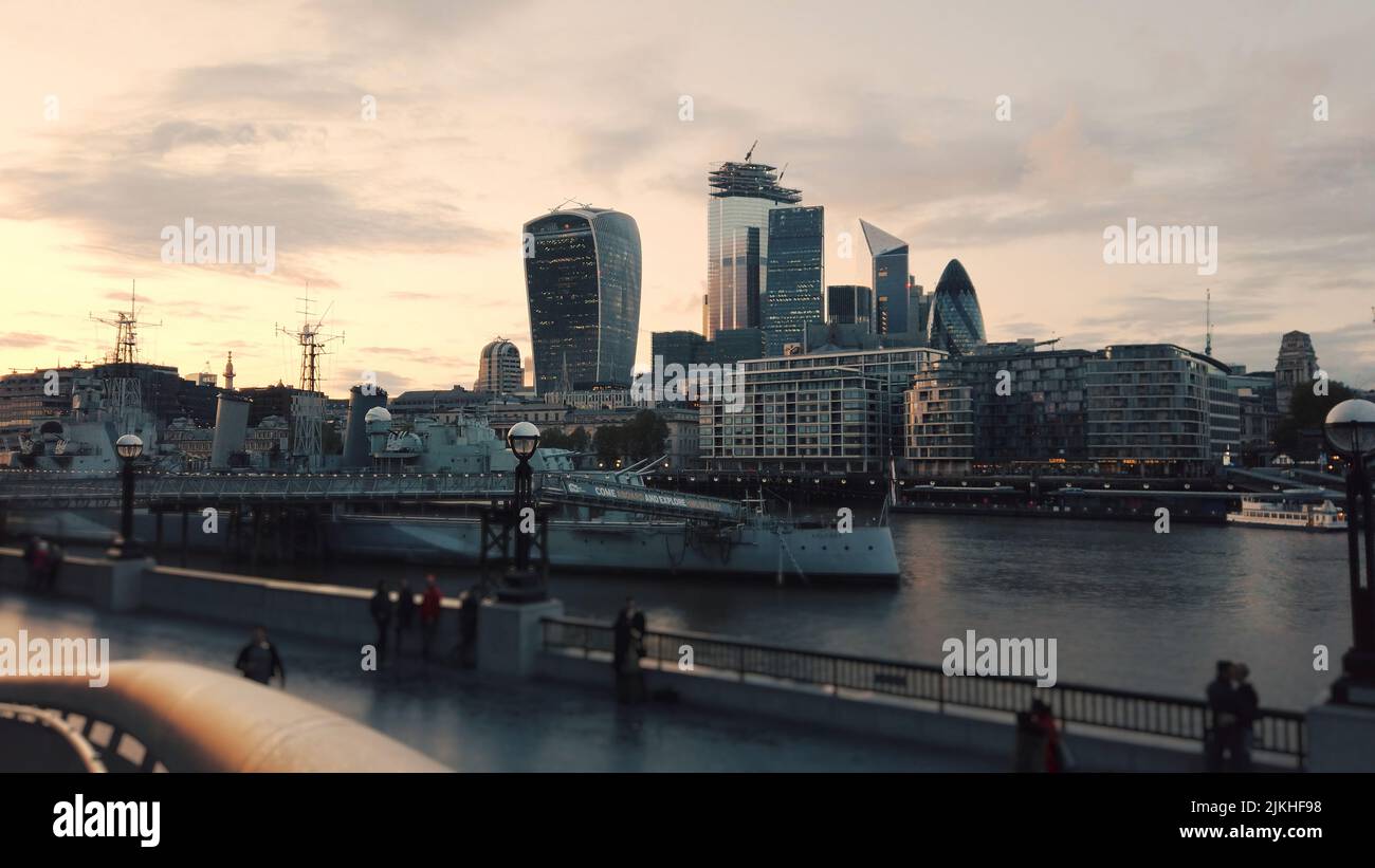 A beautiful sunset at river Thames with buildings in the city center of ...