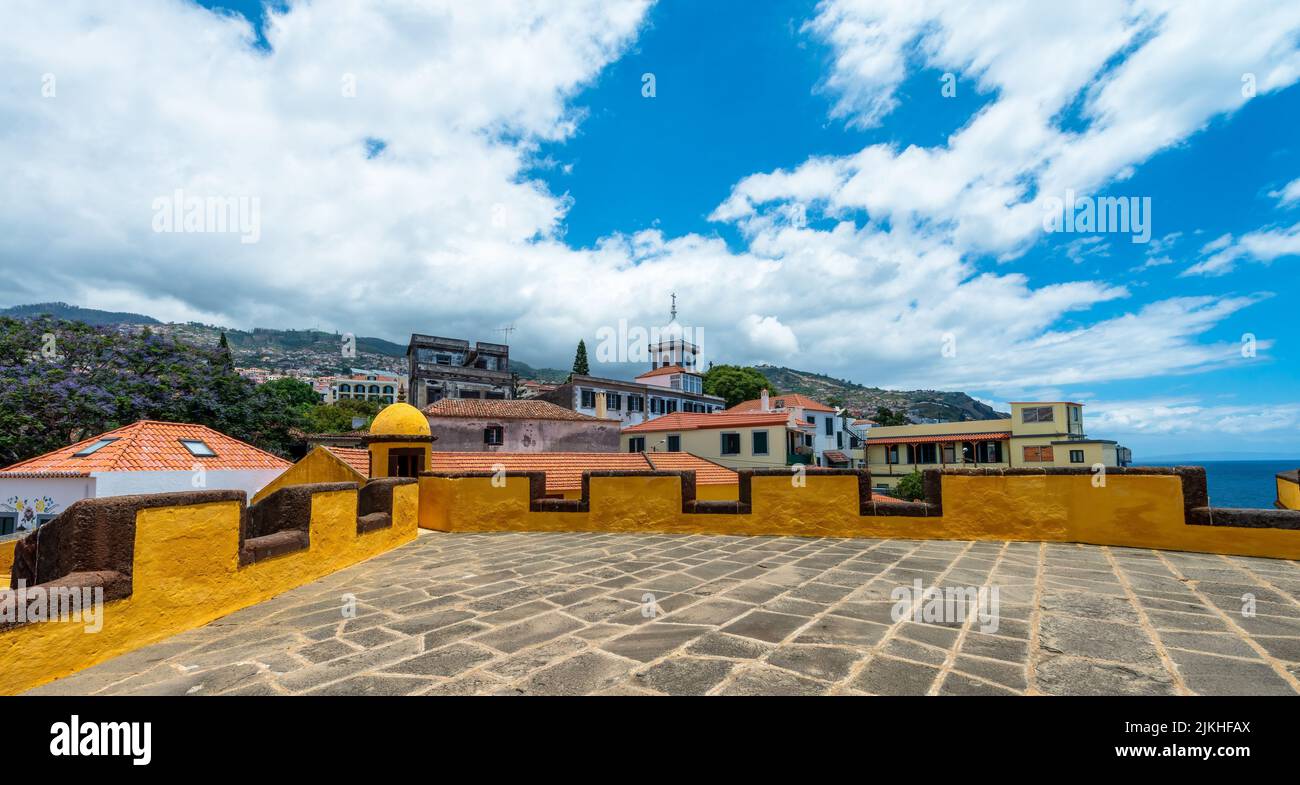 The buildings and mountain under cloudy sky from the roof of Yellow ...