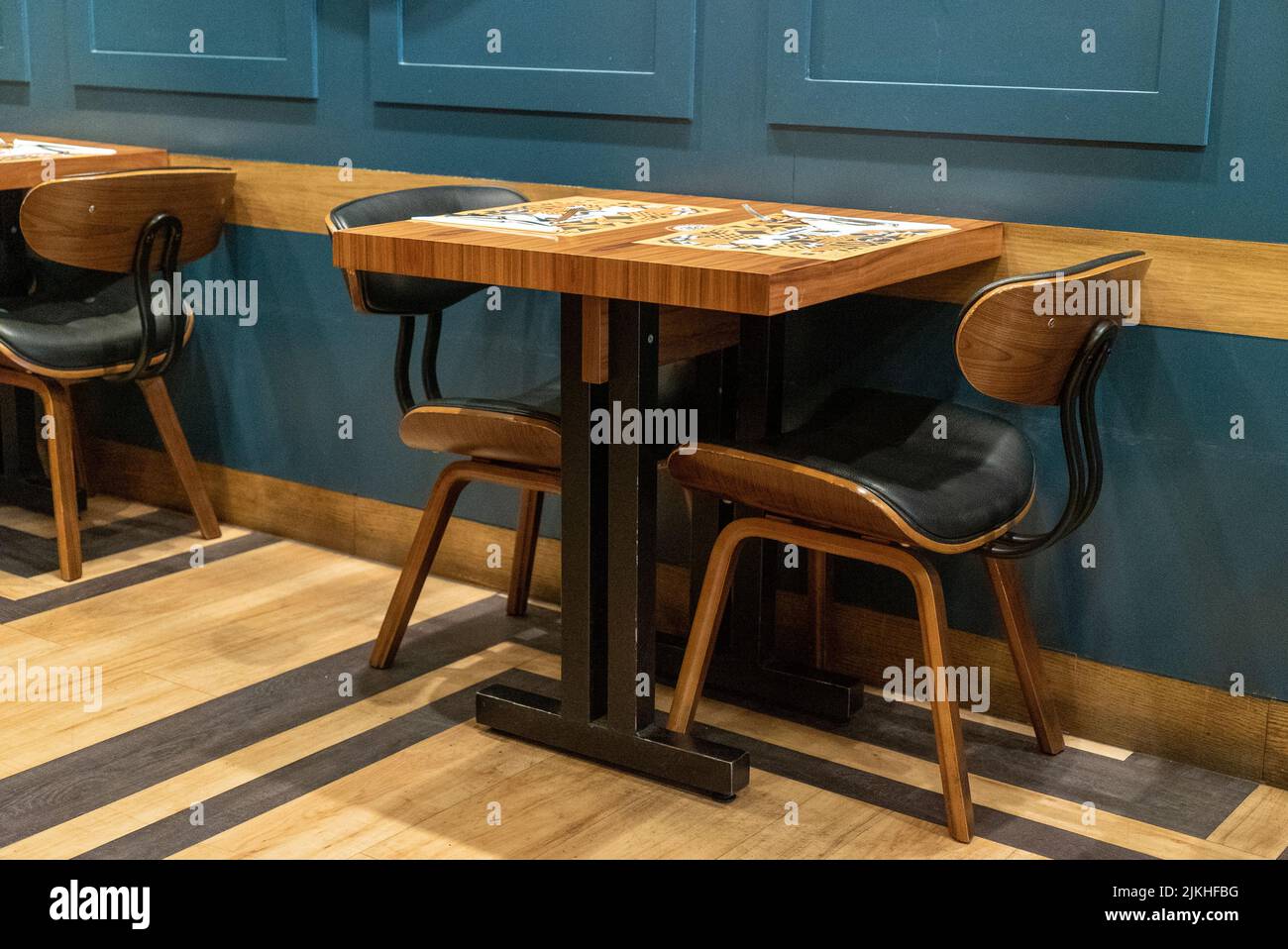 An empty small, cozy table and two chairs in good restaurant Stock ...