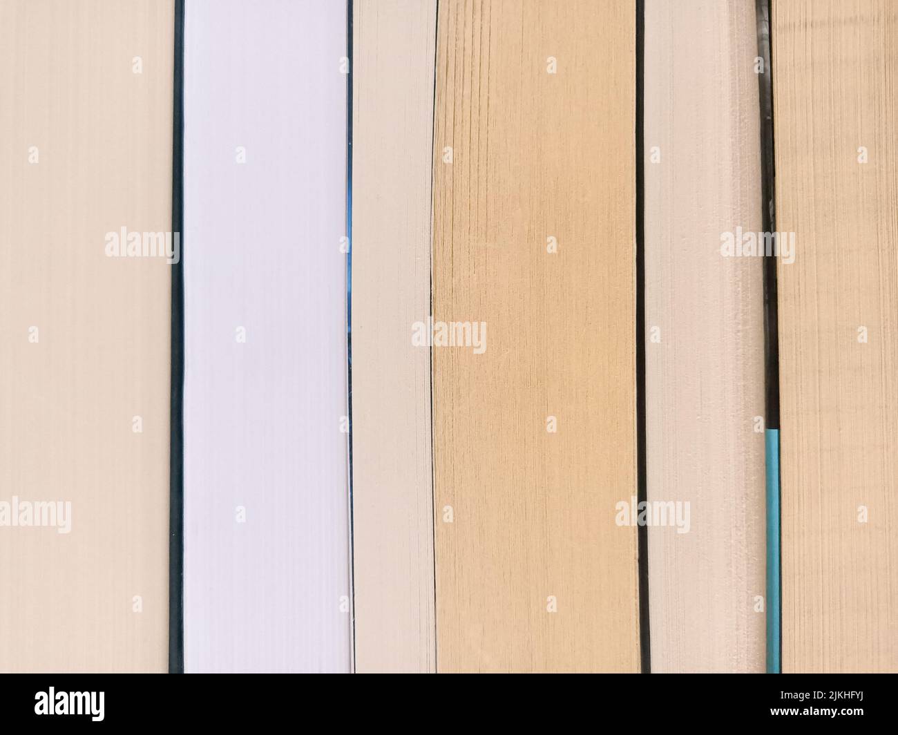 A closeup of a book stack, paper texture Stock Photo - Alamy