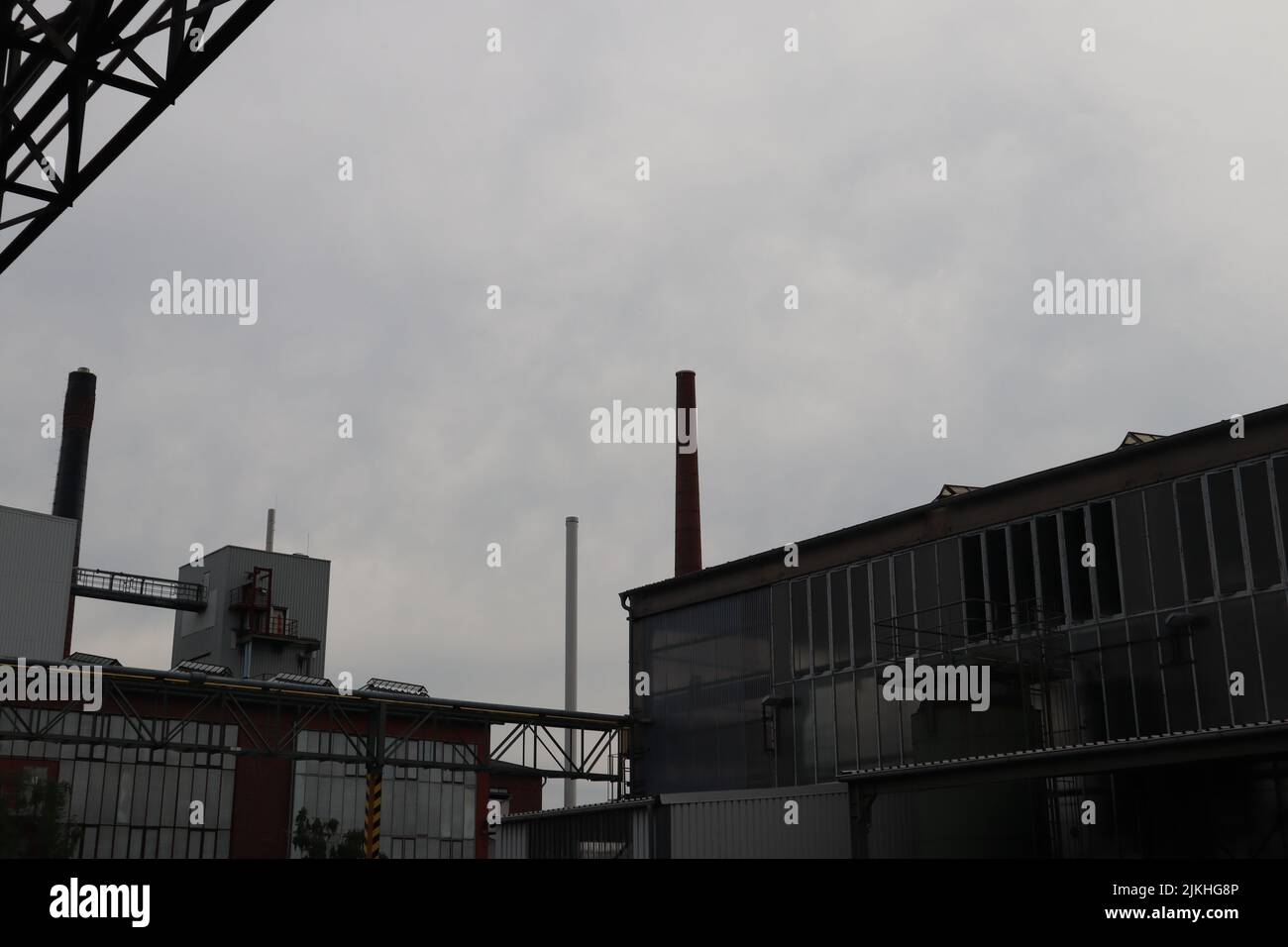 an old industrial warehouse surrounded by infrastructure Stock Photo ...