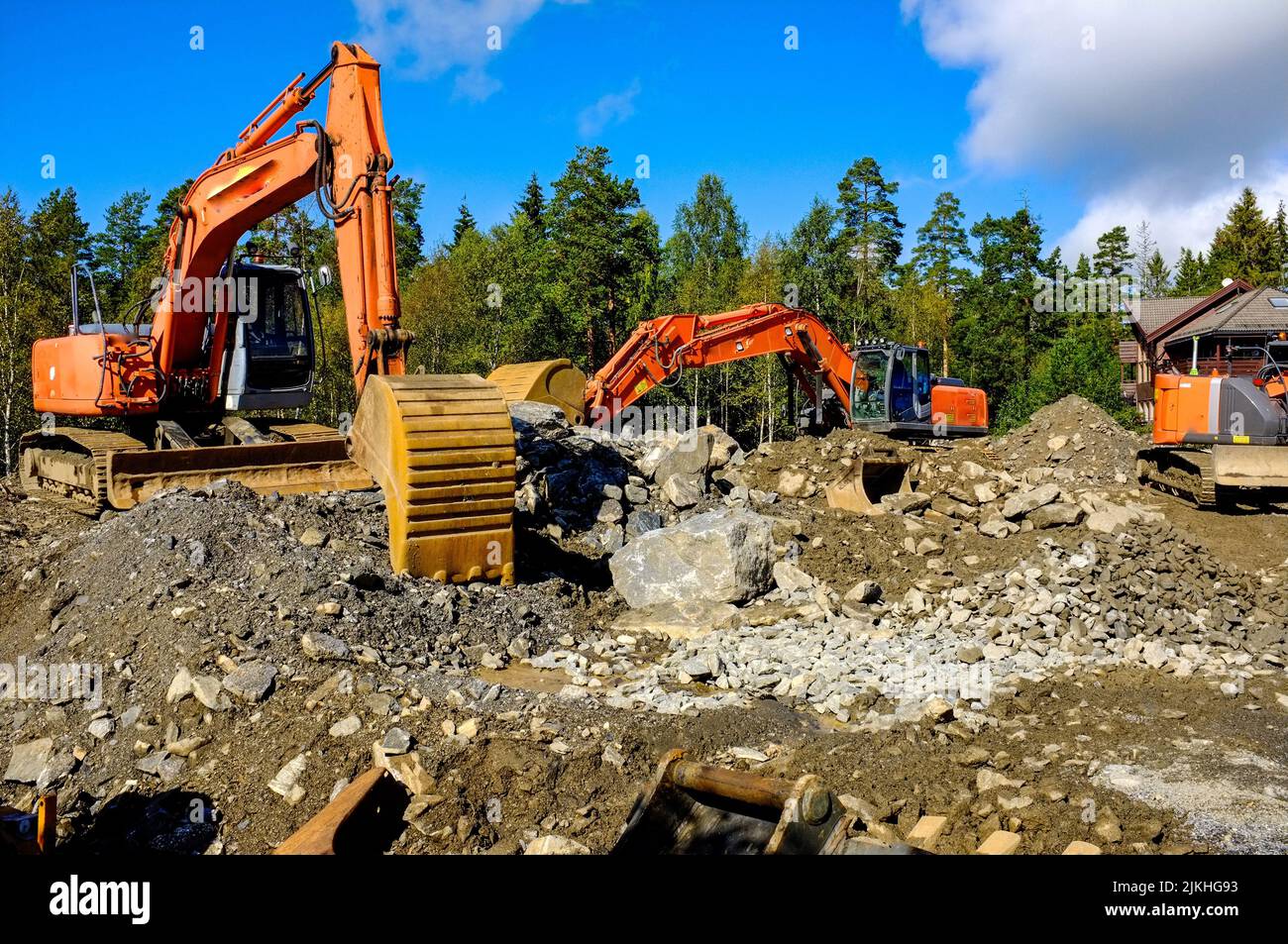 Excavators at work on the construction site Stock Photo - Alamy