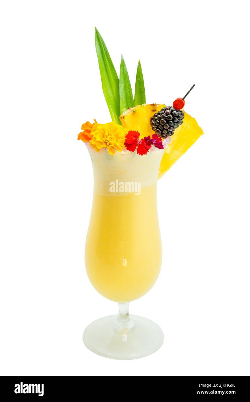 Pina colada cocktail decorated with fruits and edible flowers isolated ...
