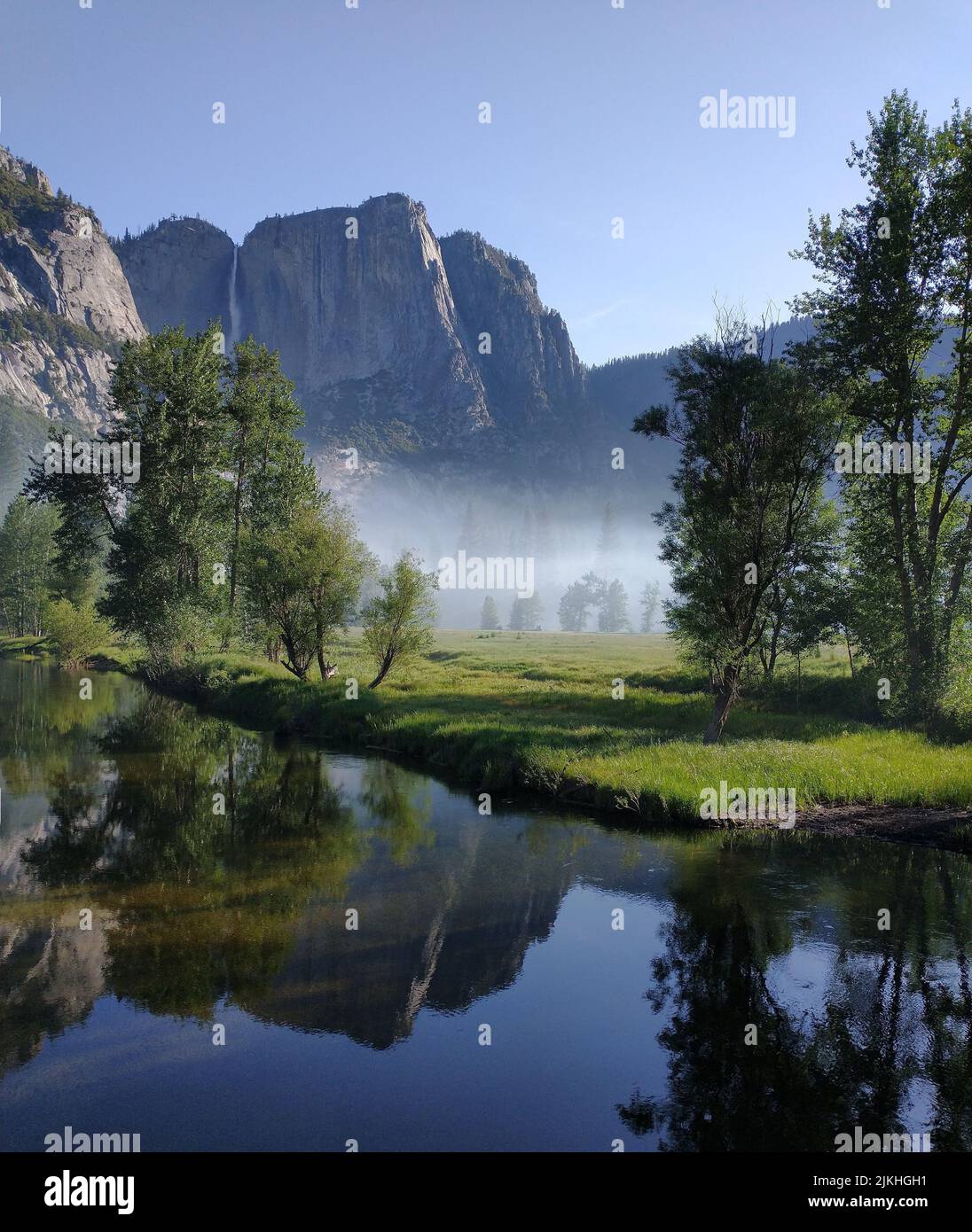 A mesmerizing vertical view of reflection in Merced River of Yosemite ...