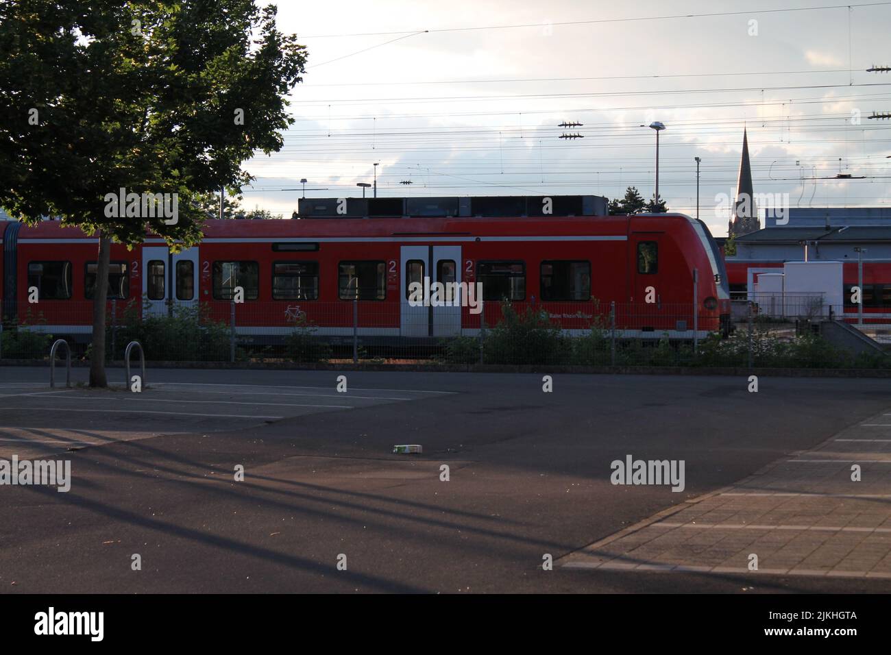 train rolling in a German railway station while sunset Stock Photo - Alamy