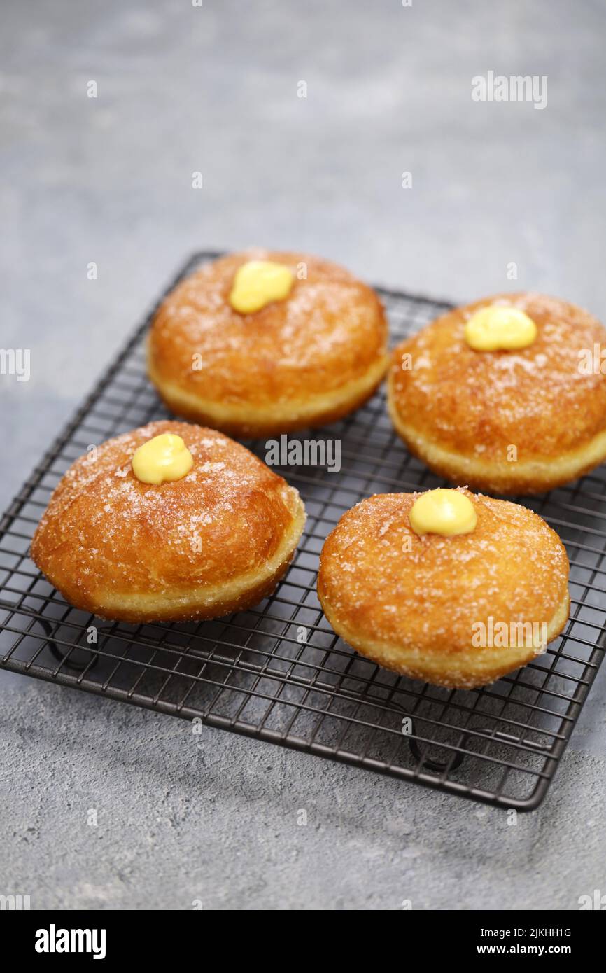 homemade Bomboloni filled with custard, Italian stuffed donuts Stock ...