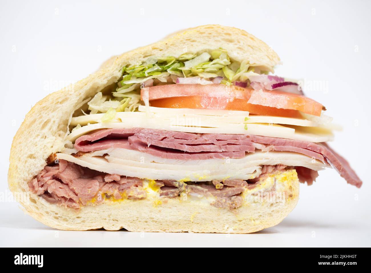 An Italian sub sandwich portraying all of its ingredients on a white ...