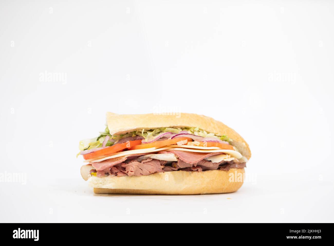 An Italian sub sandwich portraying all of its ingredients on a white ...