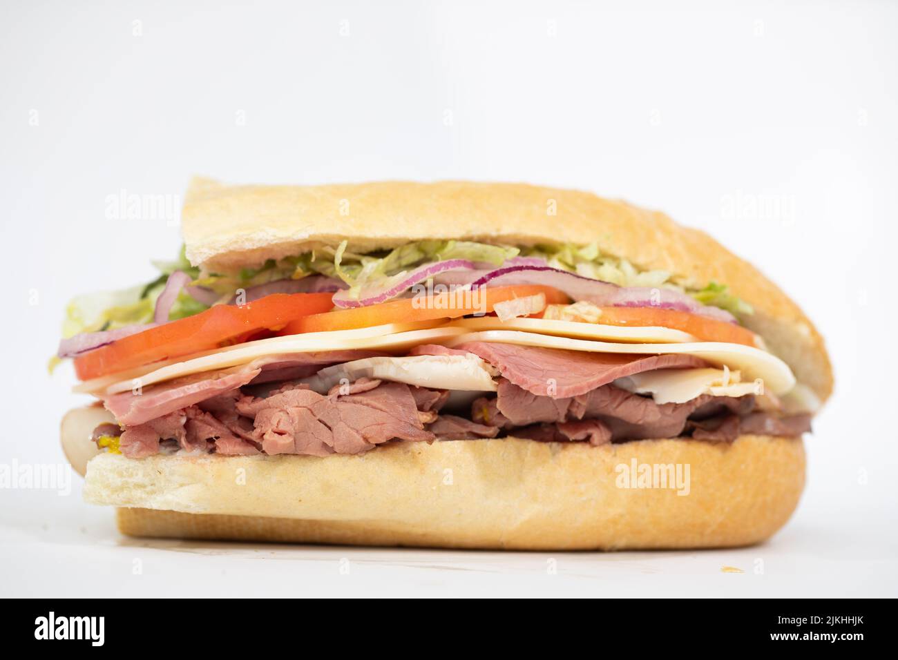 An Italian sub sandwich portraying all of its ingredients on a white ...