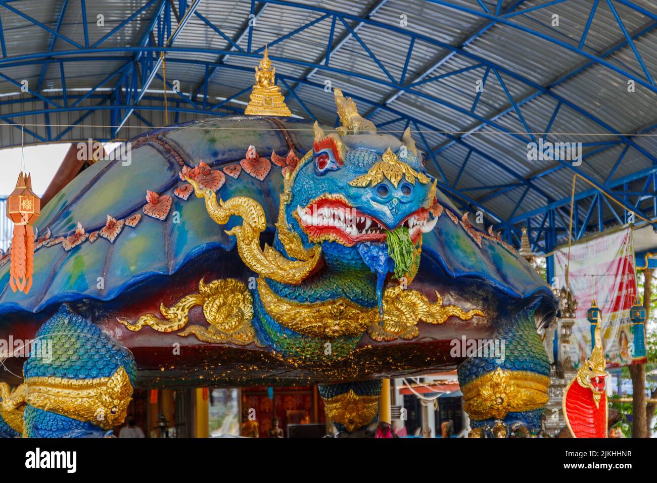 A big blue turtle sculpture in a small village temple in Bang Sare ...