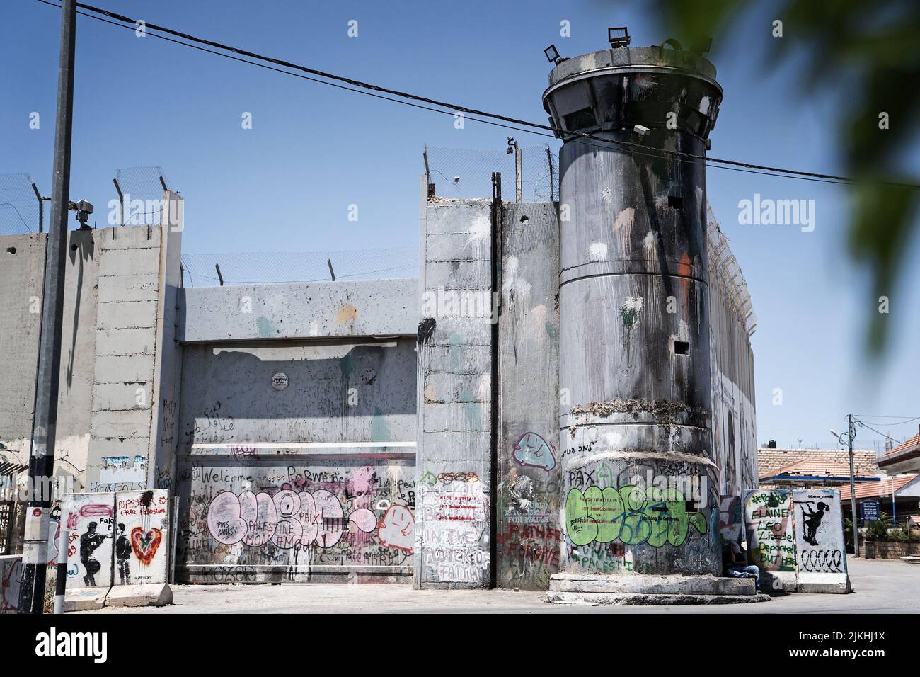A view of the tower on the border between Israel and Palestine covered ...