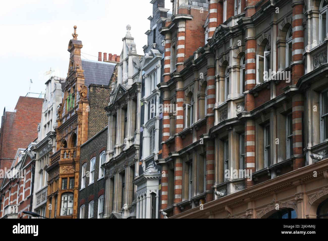 A low angle shot of a facade of classic Victorian buildings in the ...