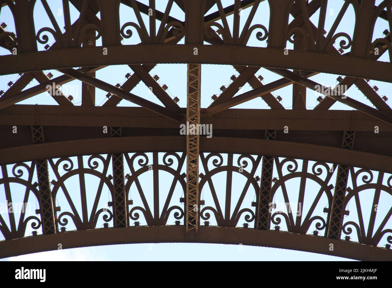 An inside view of the Eiffel Tower in Paris, France in blue sky ...