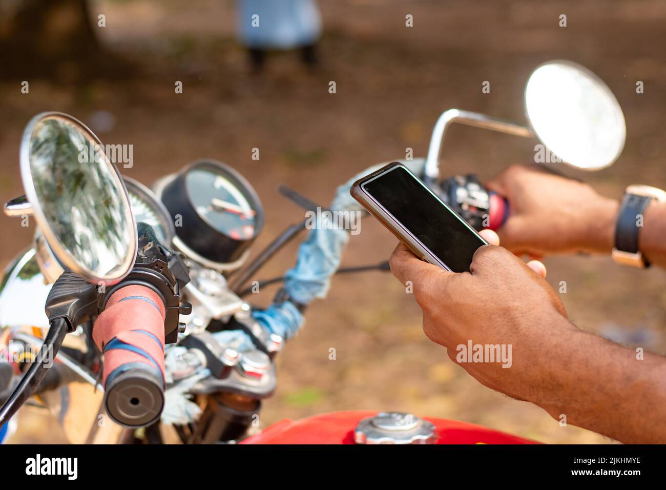 african bike rider using his phone Stock Photo - Alamy