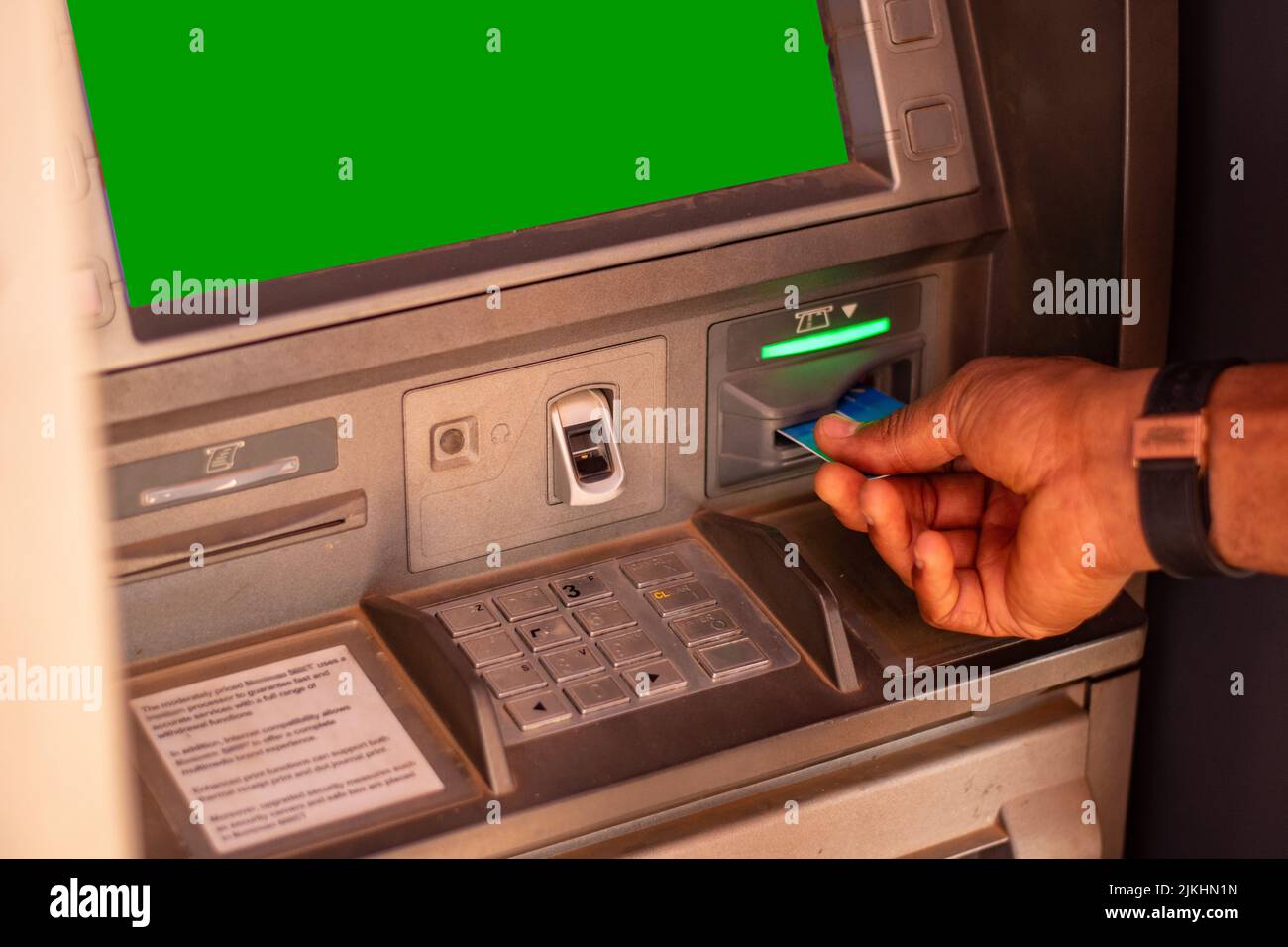 african person using an atm Stock Photo - Alamy