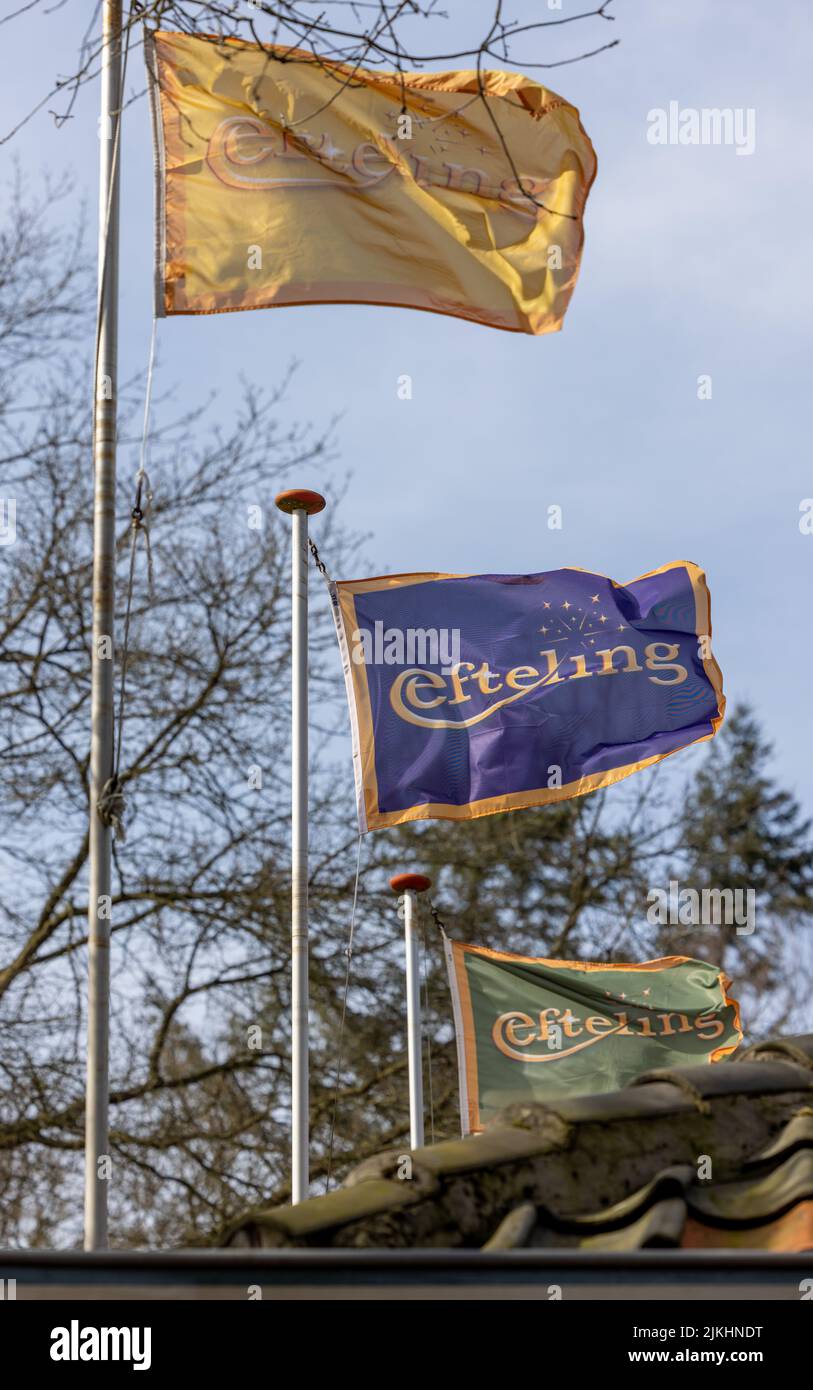 A vertical shot of three flags of the Efteling amusement park in the ...