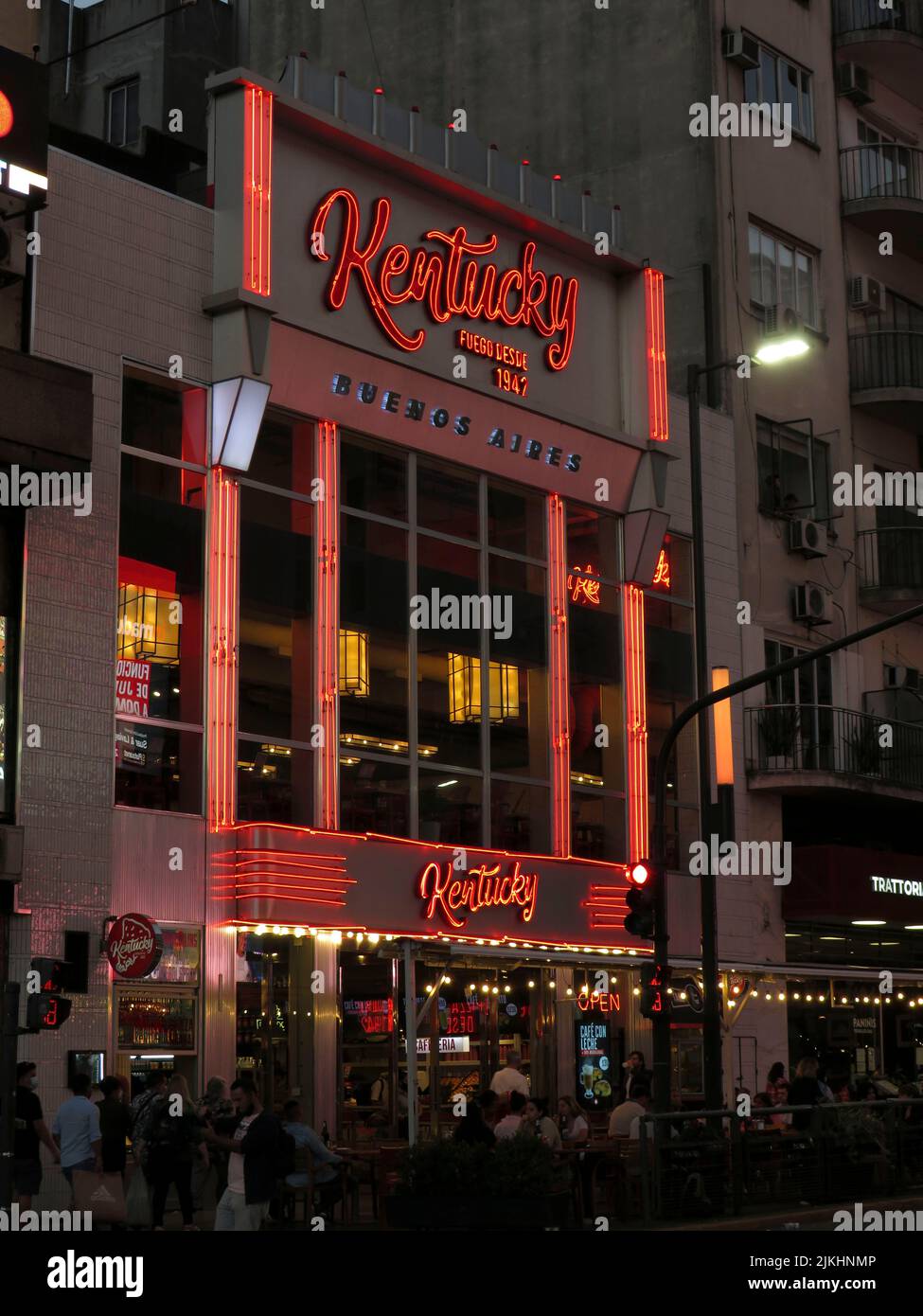 A vertical shot of the facade of the Kentucky Pizzeria at night in ...