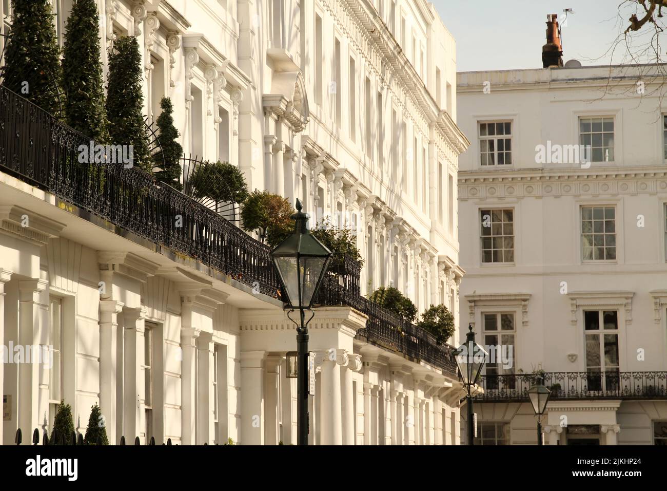 A beautiful white building facade with trees on balconies in Chelsea ...
