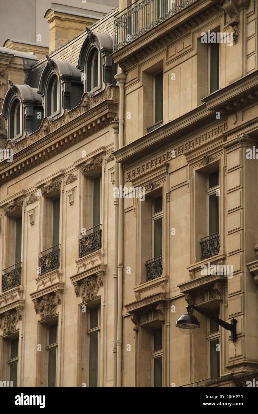 A beautiful view of an old building with small windows in the Paris ...