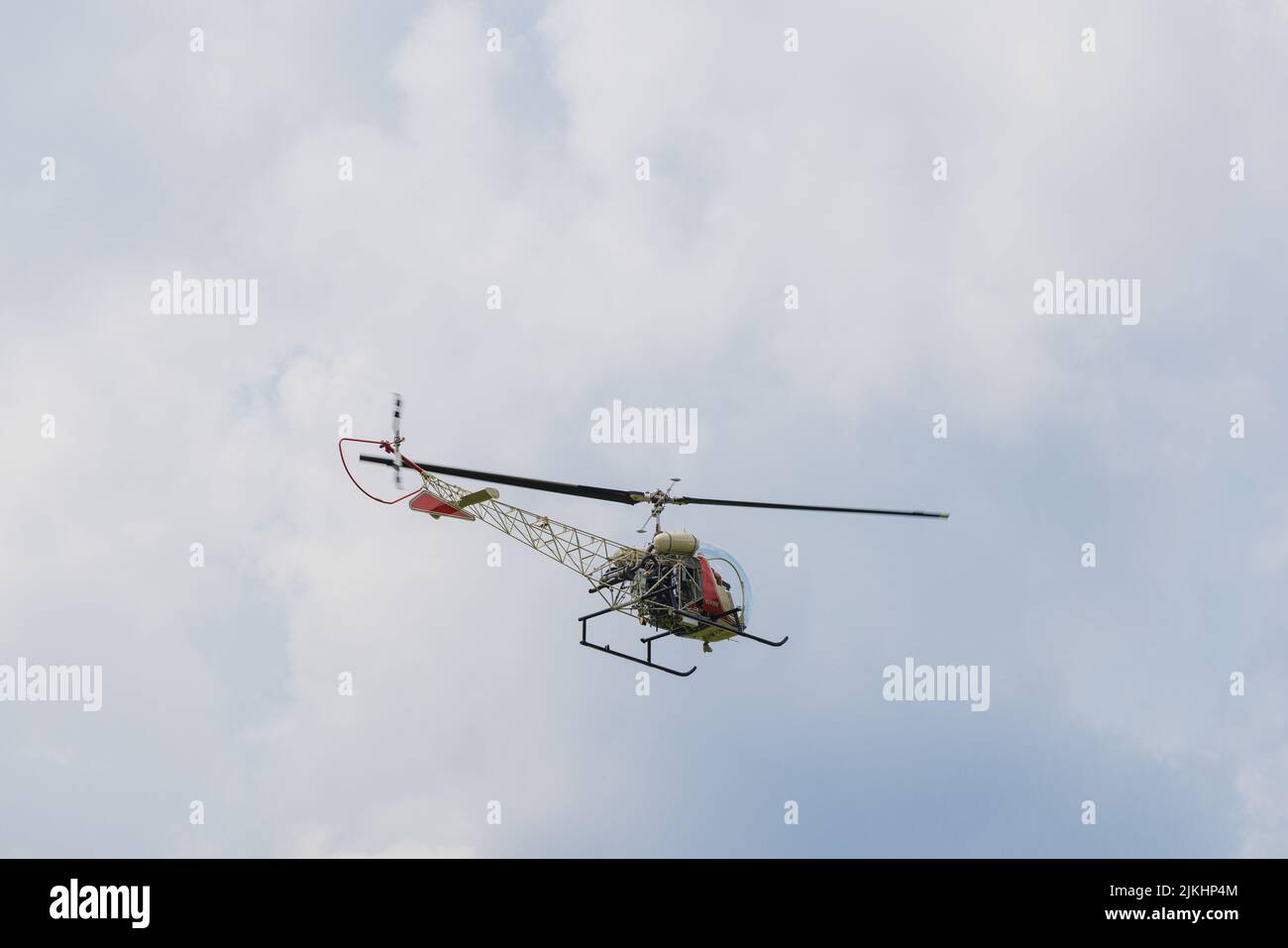 A beautiful view of a Small light helicopter giving a tour in a cloudy ...
