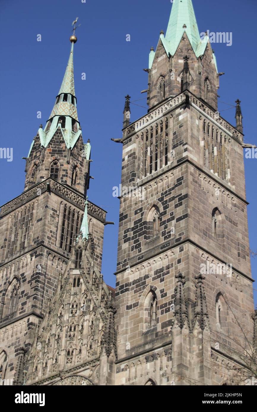 A vertical shot of historic towers in the old town of Nuremberg ...