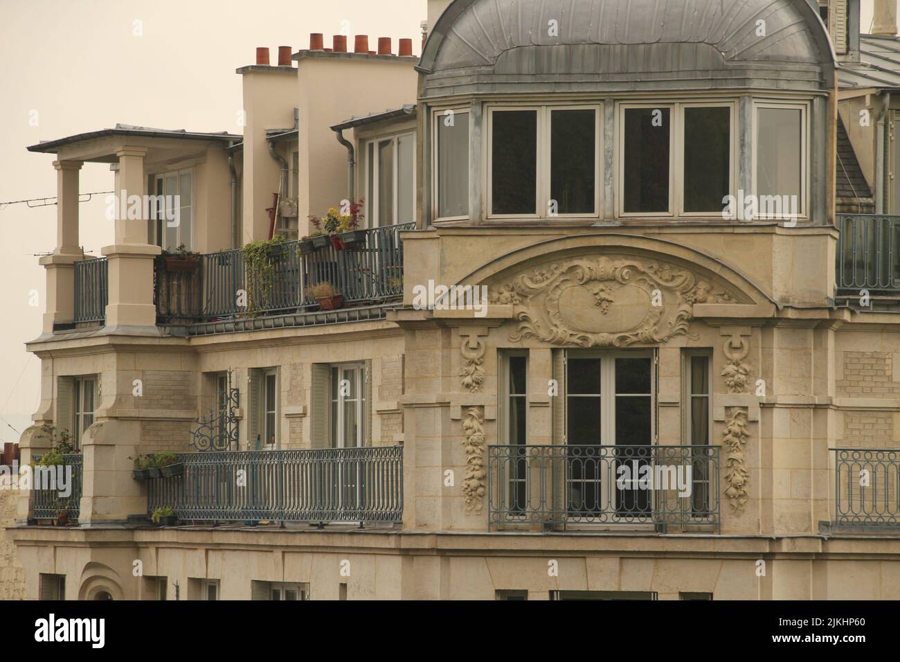 A closeup shot of the French style building facade with balconies in ...