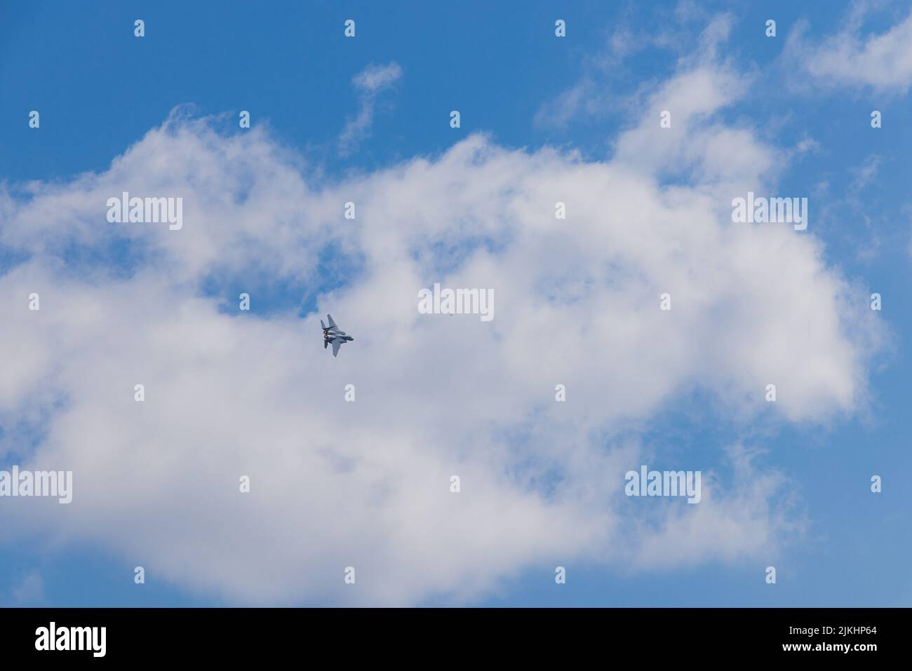 A beautiful view of a F18 Fighter Jet in a sky with clouds Stock Photo ...