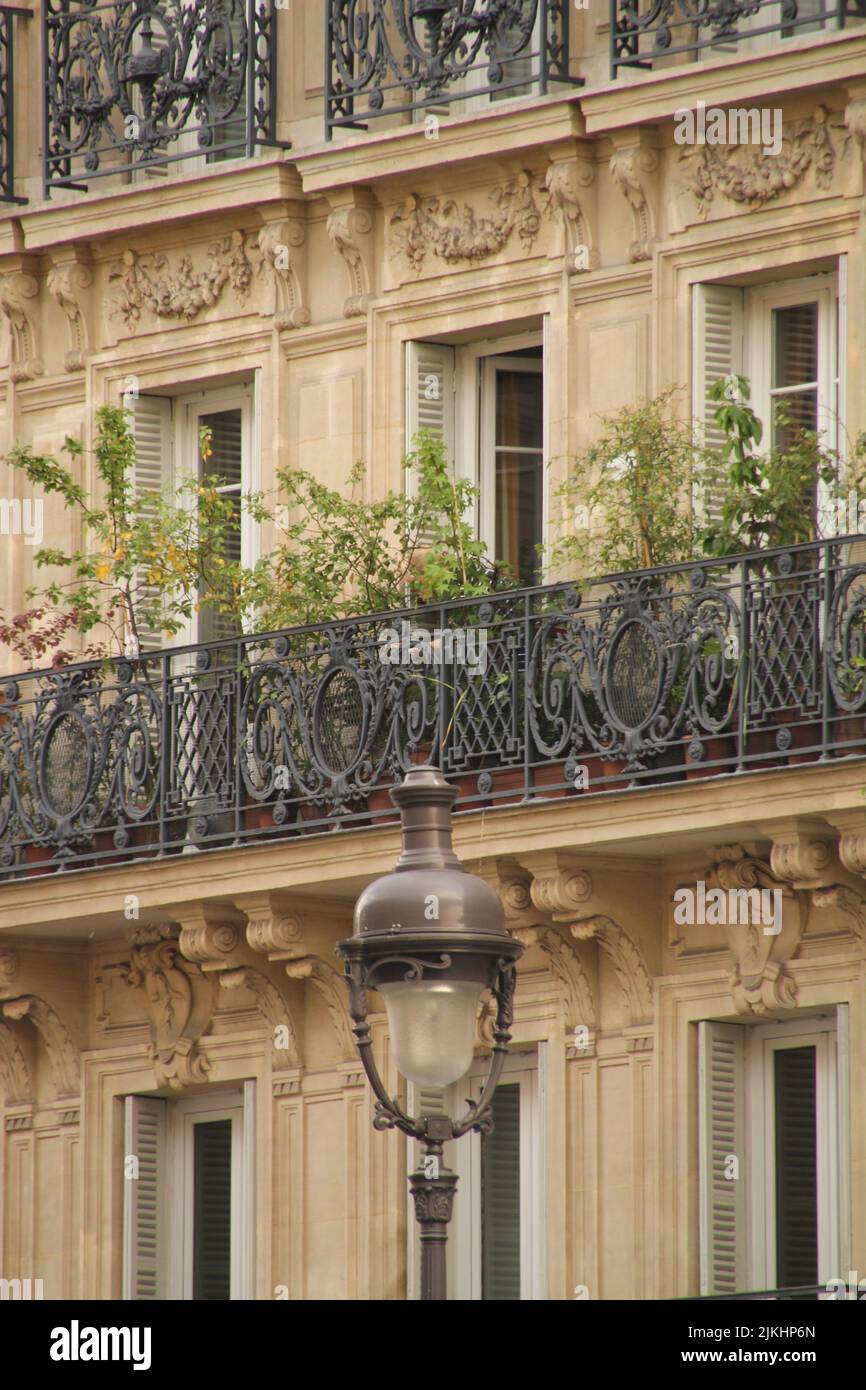 A vertical closeup shot of the French style building facade with ...