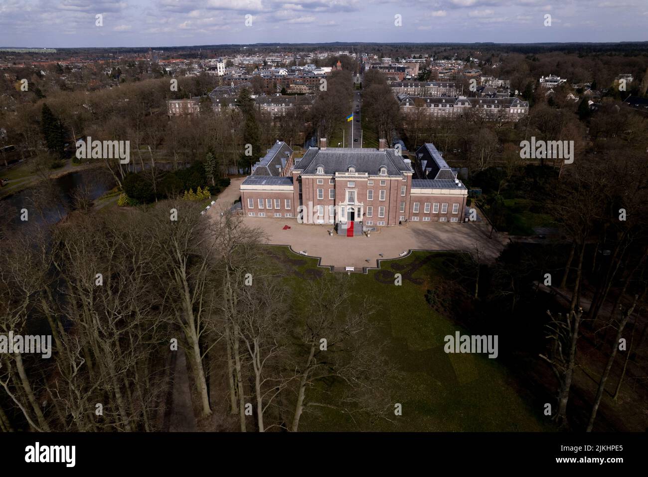 Facade of Slot Zeist castle with the moated manor surrounded by green ...