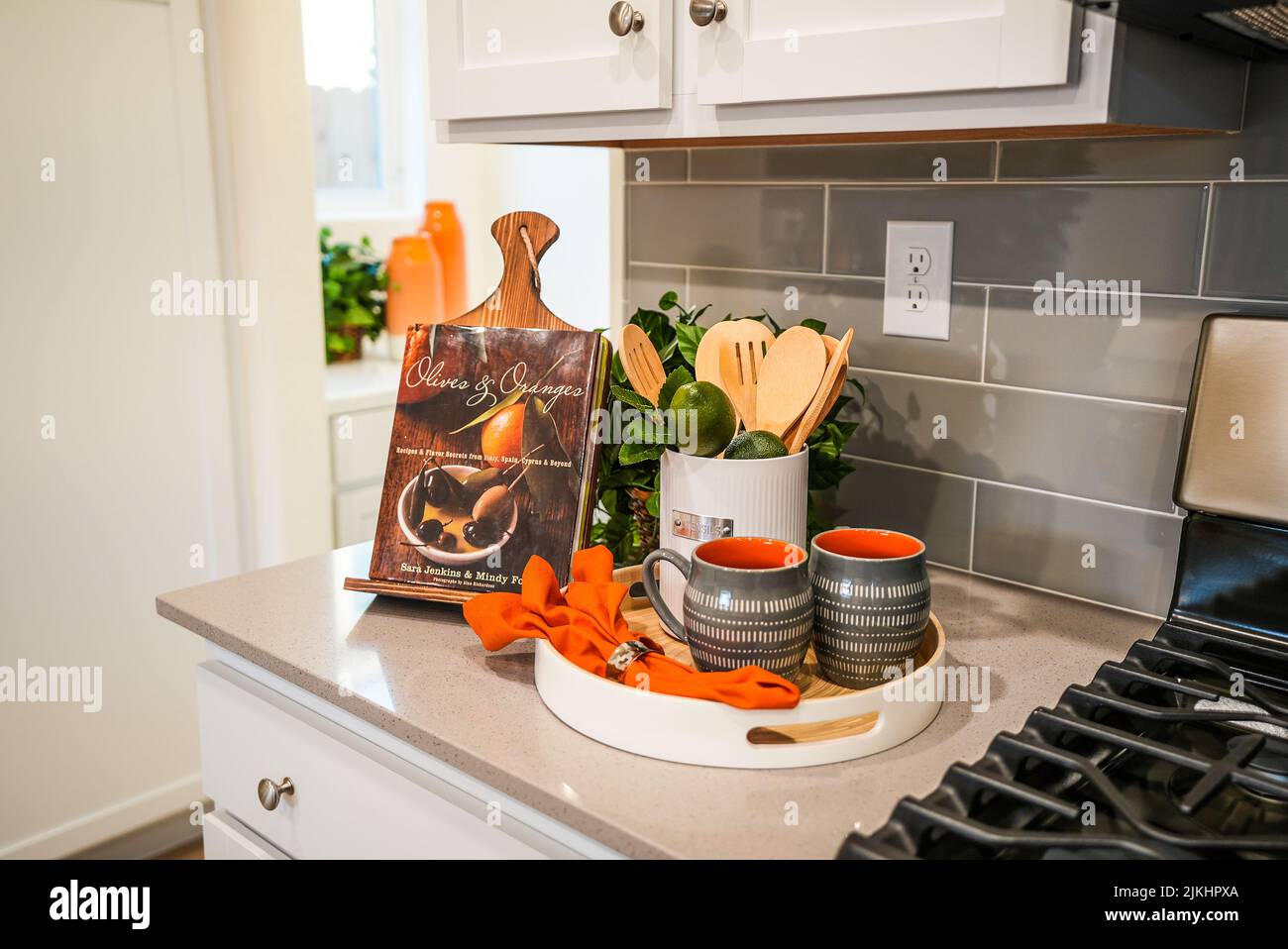The kitchenware in a kitchen with modern furniture and appliances Stock ...