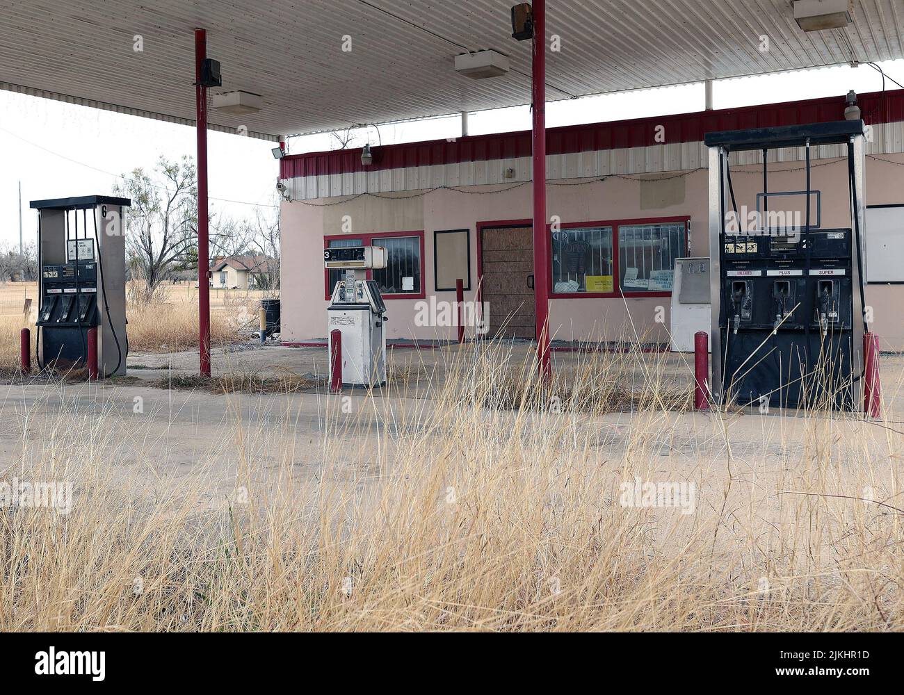 An old abandoned gas station in the small town of Lytle with over grown ...