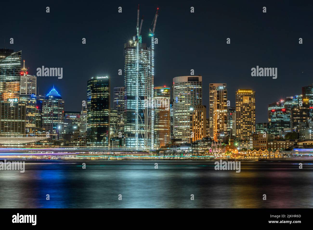 A Panoramic view of skyscrapers and modern buildings against night sky ...