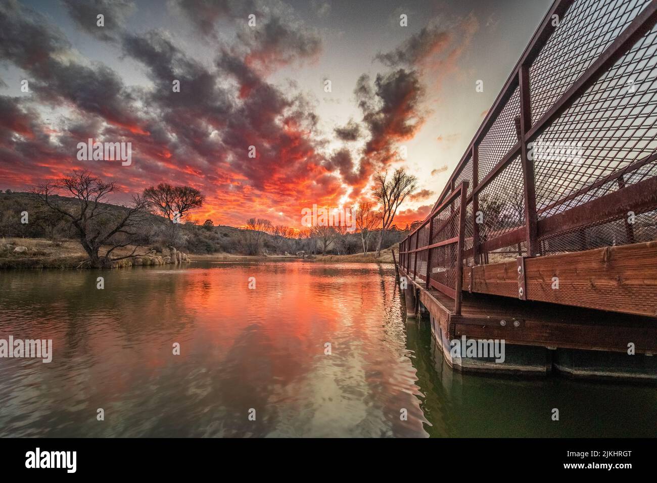 A colorful Sunset at Fain Park near the bridge that crosses Fain Lake ...