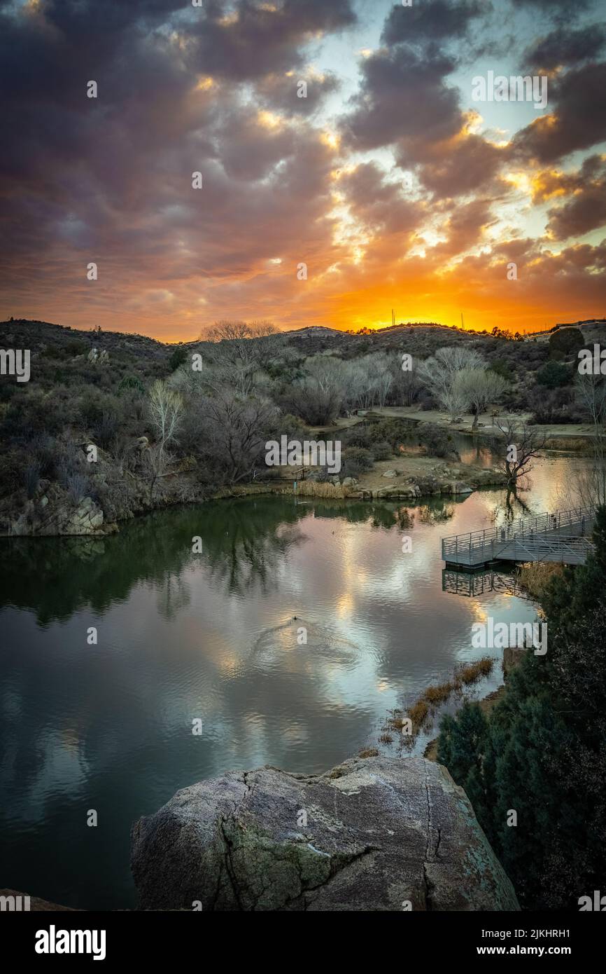 A vertical shot of the sunset at Fain Lake in Fain Park, Prescott ...