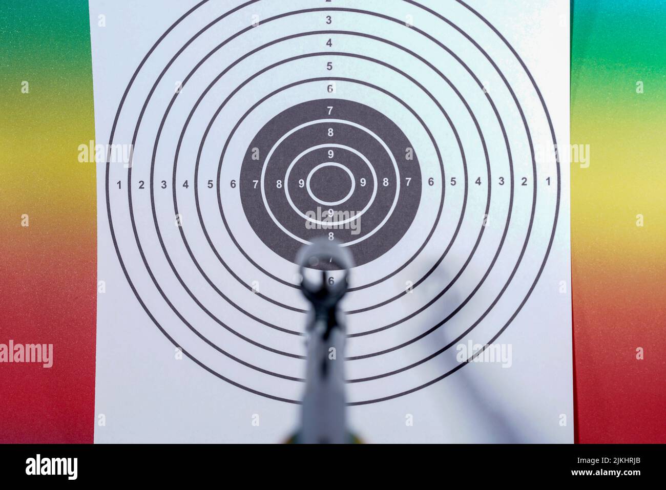 A target on white paper on a colorful background Stock Photo - Alamy