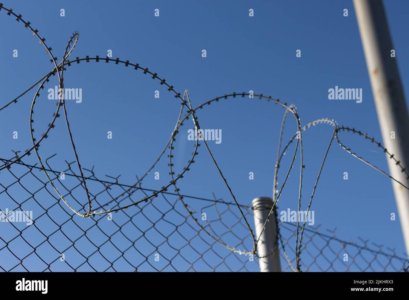 A low angle shot of barbed wires against a sky background Stock Photo ...