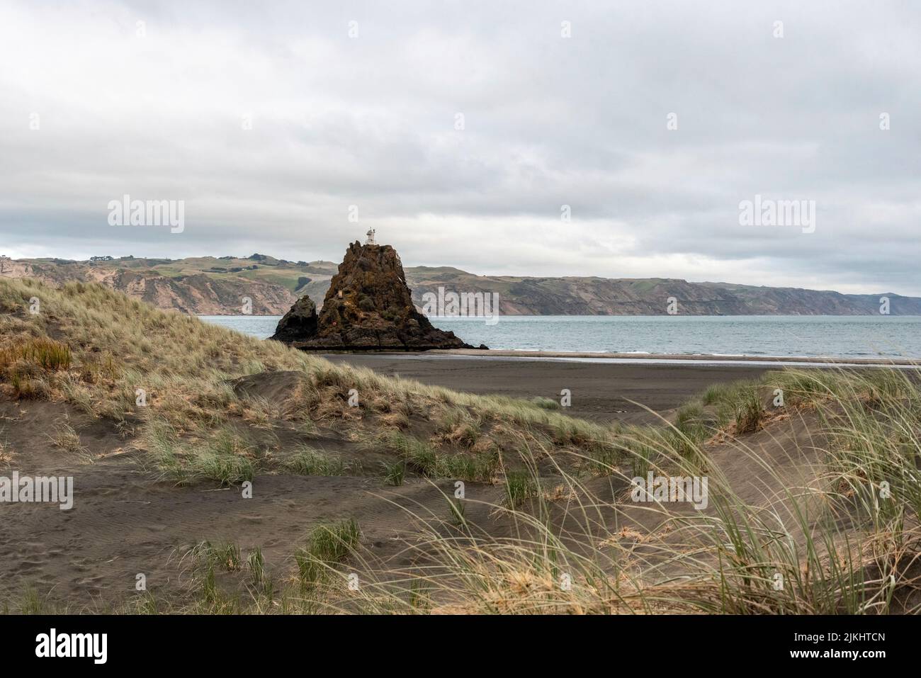 Dark colored sand at Whatipu beach near Auckland, New Zealand Stock ...