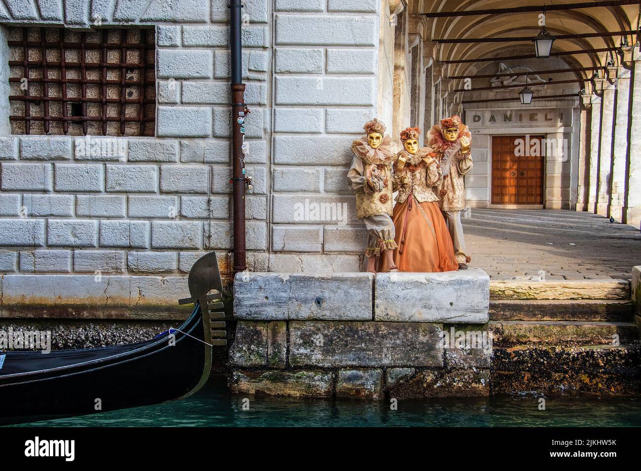 A group of people wearing beautiful masks and costumes for the Venetian ...