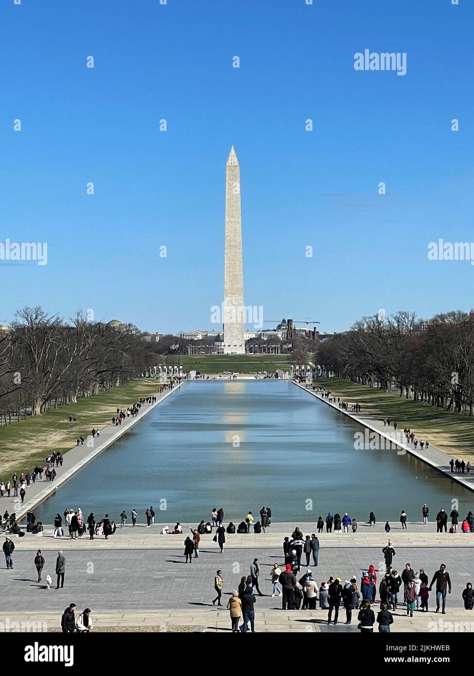 A vertical shot of the beautiful Washington Monument under a clear blue ...