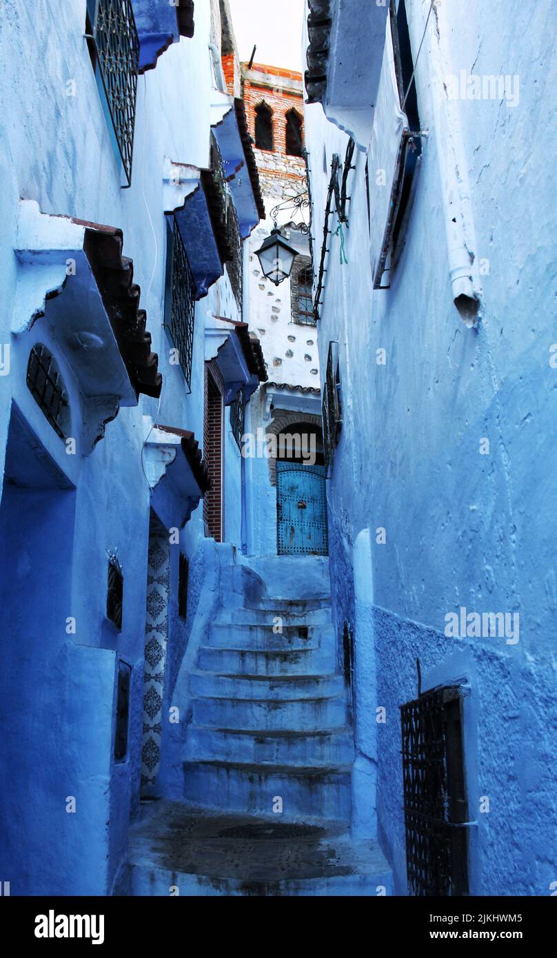 A vertical shot of old buildings in the alleys of Chefchaouen city in ...