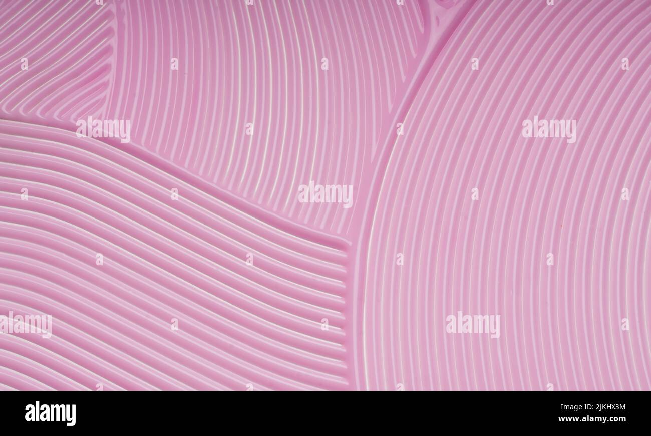 A pink skin care product wavy texture swat Stock Photo - Alamy