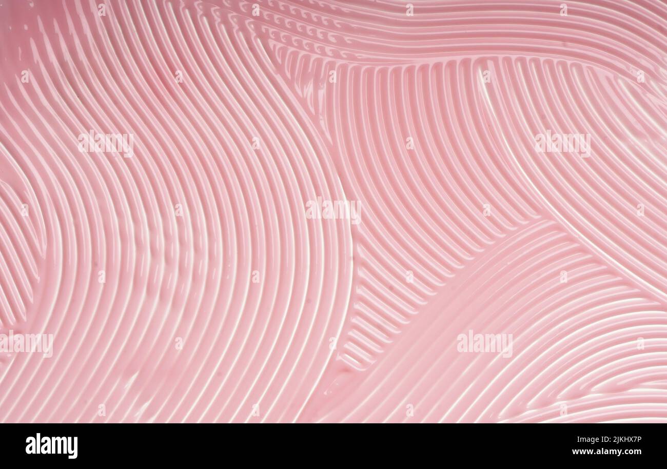 A pink skin care product wavy texture swat Stock Photo - Alamy